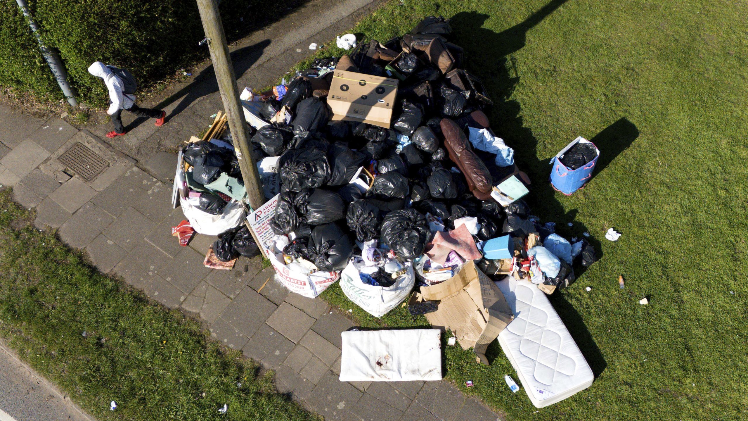Garbage piles up on Birmingham's streets as a sanitation strike in the ...