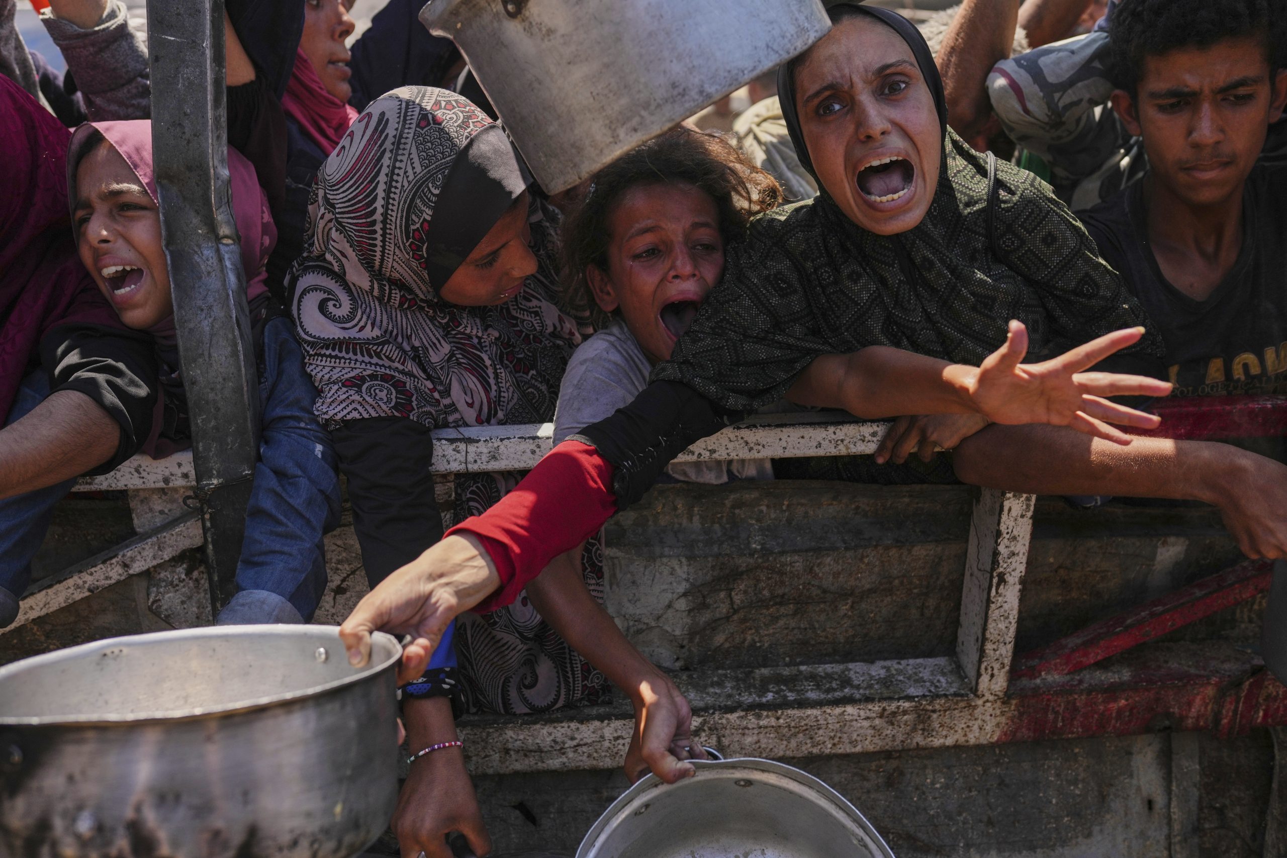 Photos show Palestinians struggling for food as famine grips Gaza's ...