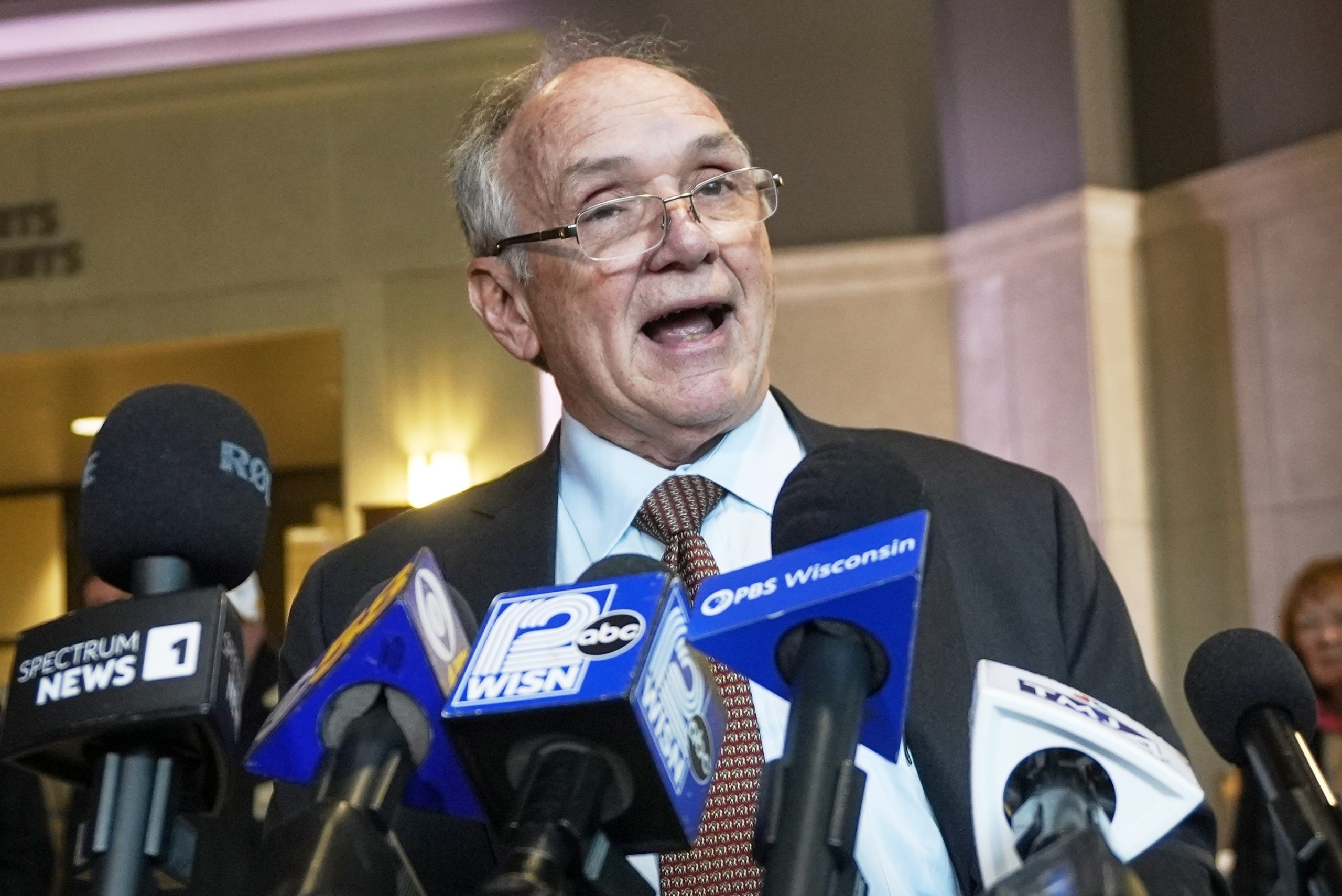 Wisconsin judge rejects motions to dismiss charges against Trump aides ...