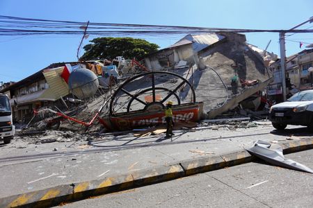Rescuers race to reach trapped after powerful quake in southern ...